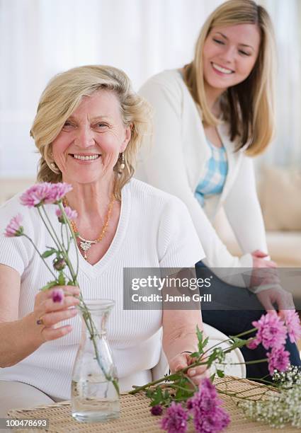 Senior Arranging Flowers Photos And Premium High Res Pictures Getty