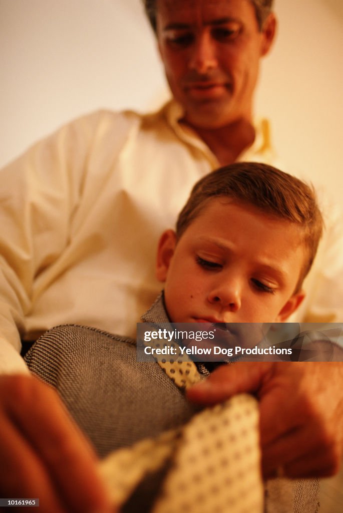 Father Helping Son Put On Tie High-Res Stock Photo - Getty Images Father Helping Son Put On Tie High-Res Stock Photo - Getty Images