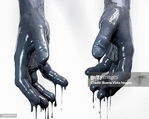 Dripping Oil Hands Photos And Premium High Res Pictures Getty Images