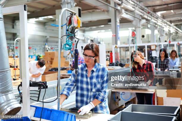 205 Manual Assembly Line Stock Photos, High-Res Pictures, and Images ... 205 Manual Assembly Line Stock Photos, High-Res Pictures, and Images ...