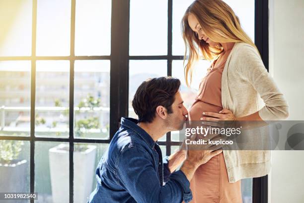 Man Kissing Woman Stomach Photos And Premium High Res Pictures Getty