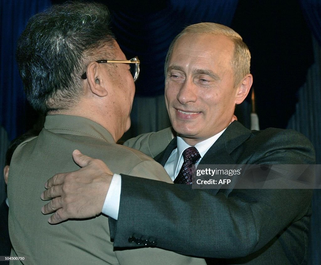 Russian President Vladimir Putin Hugs North Korean Leader Kim Jong Il