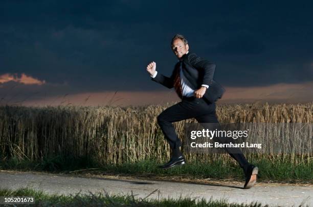 Man Running Looking Back Photos and Premium High Res Pictures - Getty ... Man Running Looking Back Photos and Premium High Res Pictures - Getty ...