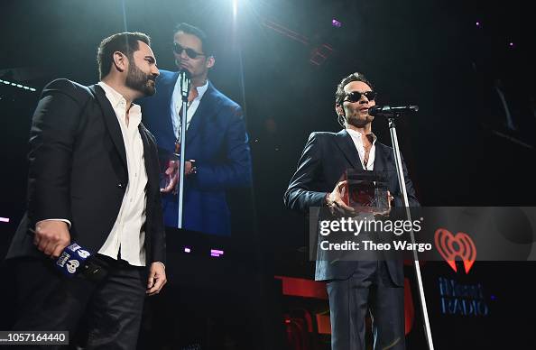 Enrique Santos And Marc Anthony Onstage At Iheartradio Fiesta Latina
