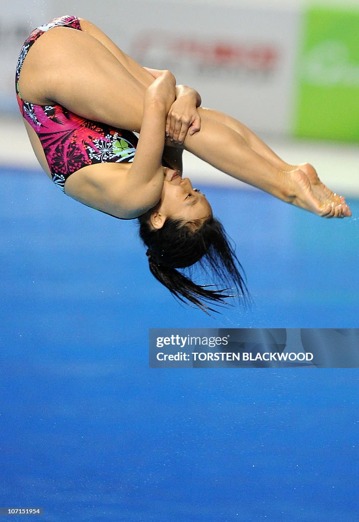 Bronze medallist Choi Sut Ian of Macau performs during the women's 3m ... Bronze medallist Choi Sut Ian of Macau performs during the women's 3m ...