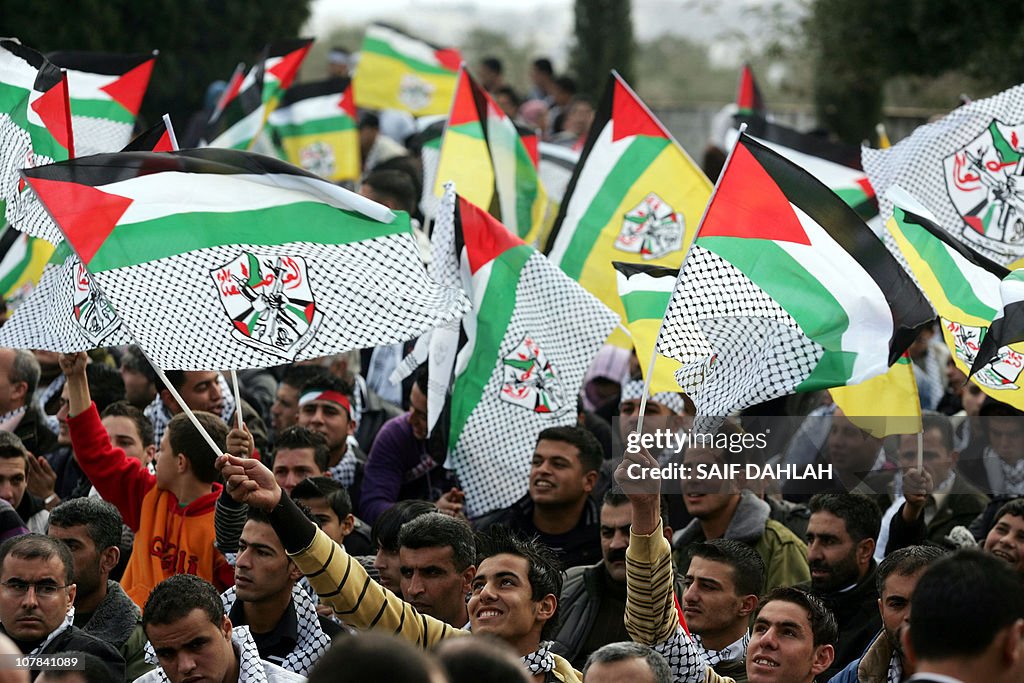 Palestinian men wae national and Fatah flags during celebrations ... Palestinian men wae national and Fatah flags during celebrations ...
