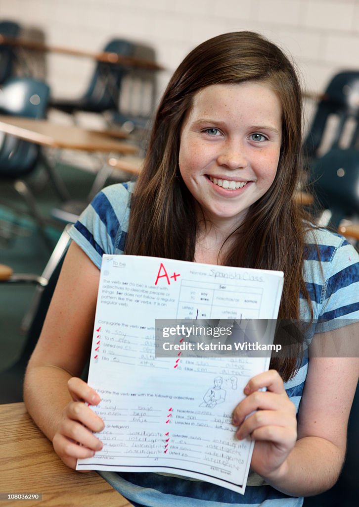 Girl Holding Classwork With An A Grade High-Res Stock Photo - Getty Images Girl Holding Classwork With An A Grade High-Res Stock Photo - Getty Images