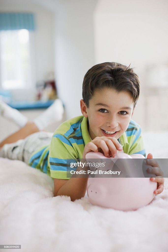 Boy Laying In Bed With Piggy Bank High-Res Stock Photo - Getty Images Boy Laying In Bed With Piggy Bank High-Res Stock Photo - Getty Images