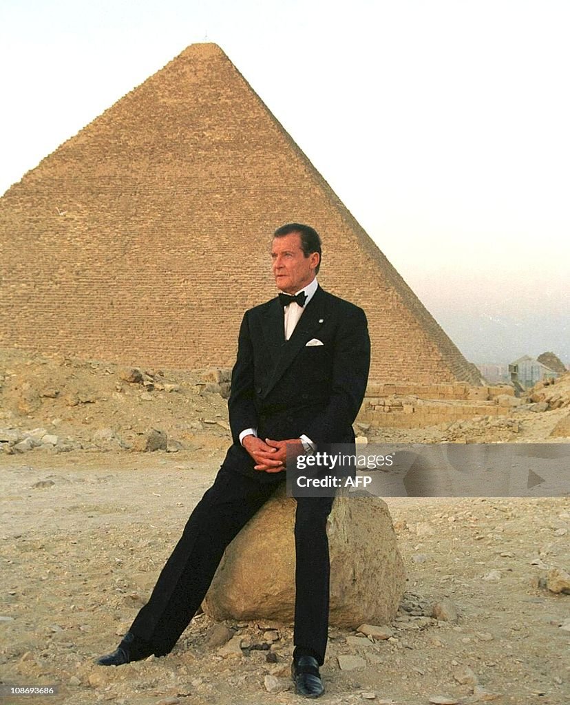Former Secret Agent 007 Roger Moore Poses In Front Of Cheops The