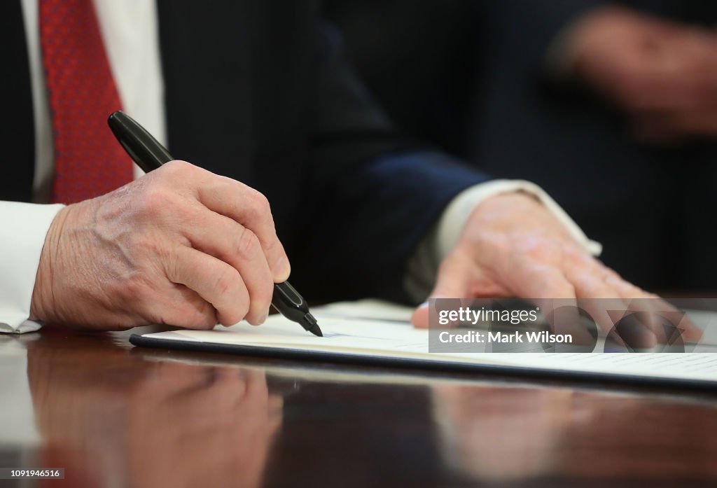 Us President Donald Trump Holds Up An Executive Order He Signed News Photo Getty Images