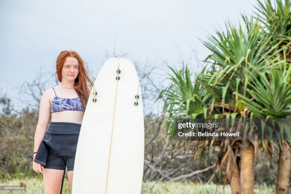 Red Haired Australian Surfer Girl Spends Time At The Beach High Res