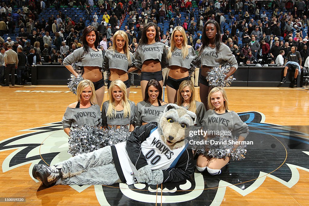 The Minnesota Timberwolves Mascot Poses With Cheerleaders After The