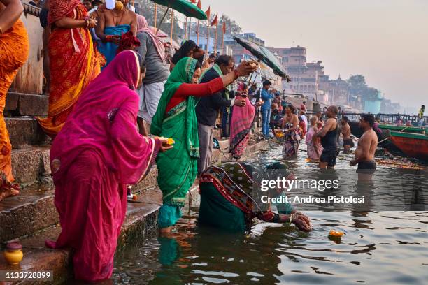 Hindu Woman Praying And Ritual Bathing In The Ganges River Photos Et