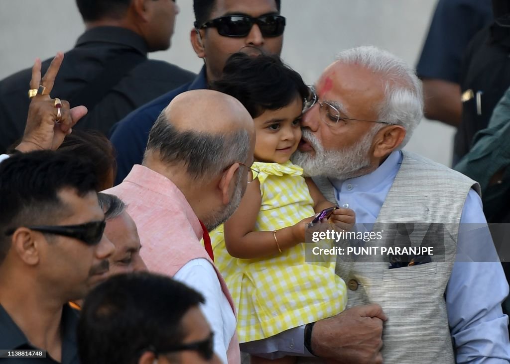Indian Prime Minister Narendra Modi Kisses The Granddaughter Of Bjp