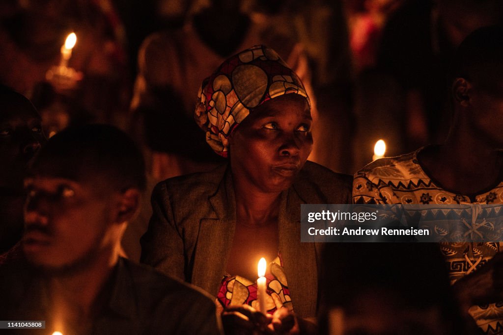People Hold Candles During A Commemoration Ceremony Of The 1994 News