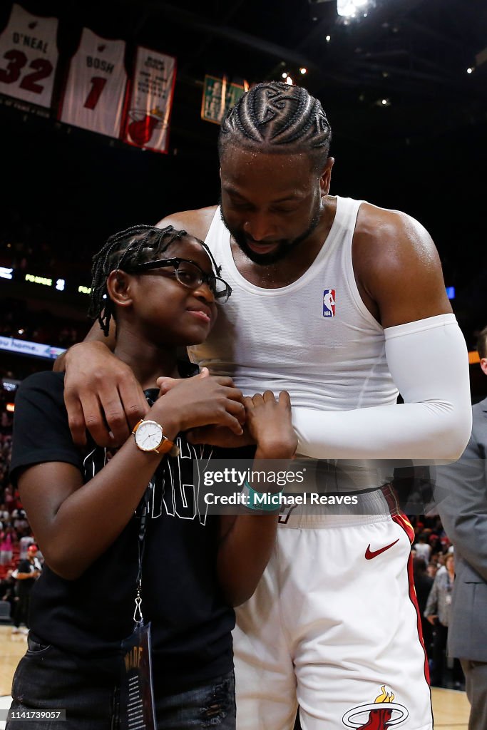 Dwyane Wade Of The Miami Heat Hugs His Son Zion Wade After His