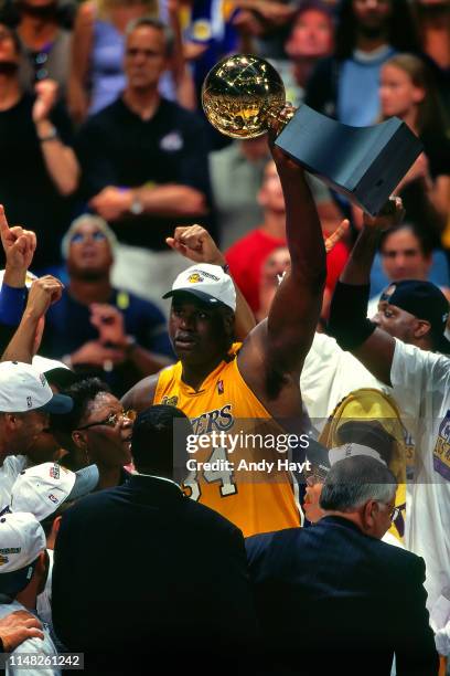 Shaquille Oneal Holding Photos And Premium High Res Pictures Getty Images