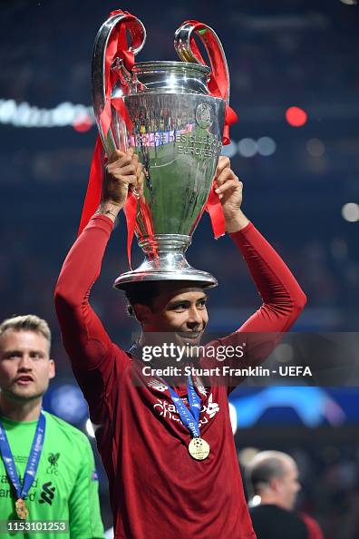 Virgil Van Dijk Of Liverpool Lifts The Champions League Trophy After