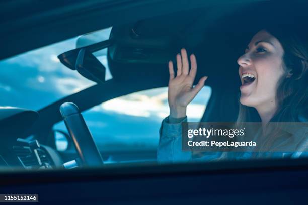 Woman Sing Car Photos And Premium High Res Pictures Getty Images
