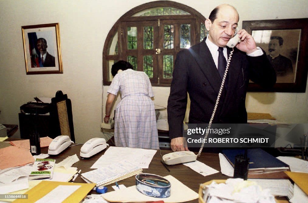 Haitian Prime Minister Robert Malval takes a phone call in his office ... Haitian Prime Minister Robert Malval takes a phone call in his office ...
