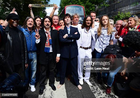 Beatles Impersonators Pose After Recreating The Iconic Abbey Road