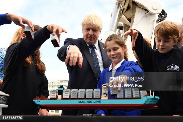U.K. Prime Minister Boris Johnson takes part in an activity with ... U.K. Prime Minister Boris Johnson takes part in an activity with ...