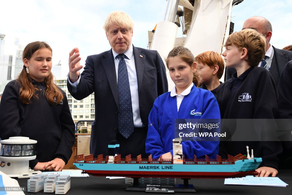U.K. Prime Minister Boris Johnson takes part in an activity with ... U.K. Prime Minister Boris Johnson takes part in an activity with ...