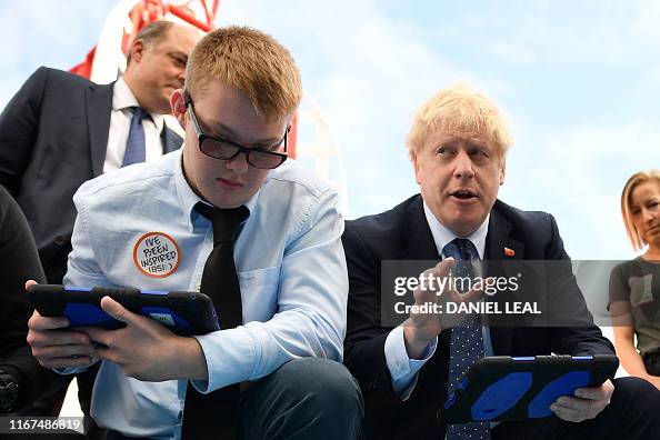 Britain's Prime Minister Boris Johnson takes part in an activity with ... Britain's Prime Minister Boris Johnson takes part in an activity with ...