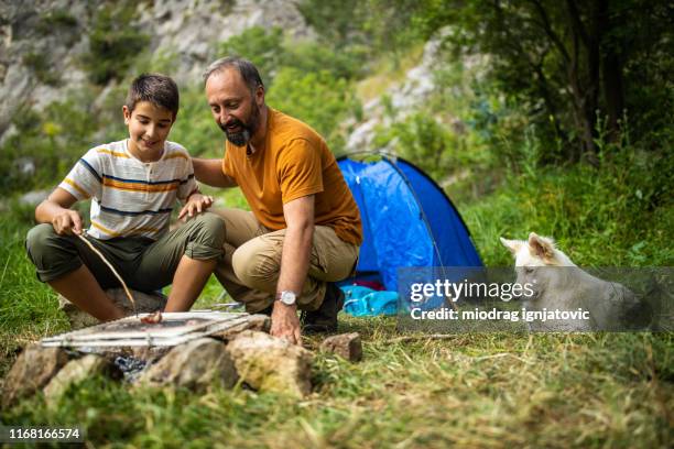 Father Son Smoking Photos And Premium High Res Pictures Getty Images