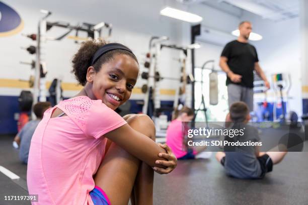Girl Sitting Holding Knees Photos Et Images De Collection Getty Images