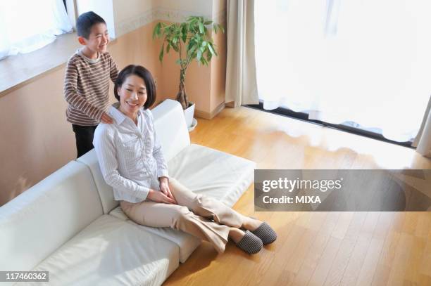 Son Massage Mom Photos And Premium High Res Pictures Getty Images