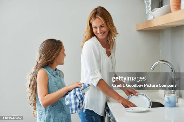 Mother And Daughter Washing Dishes Photos And Premium High Res Pictures
