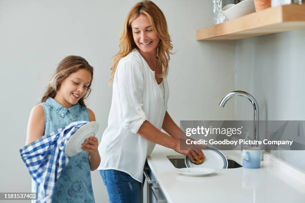 Mother And Daughter Washing Dishes Photos And Premium High Res Pictures Getty Images