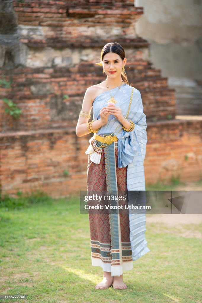 Beautiful Thai Girl In Traditional Dress Costume At Thai Temple High