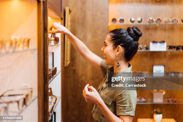 Woman Removing Glasses Photos And Premium High Res Pictures Getty Images