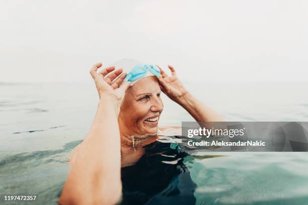 Mature Woman Swimming Sea Photos And Premium High Res Pictures Getty