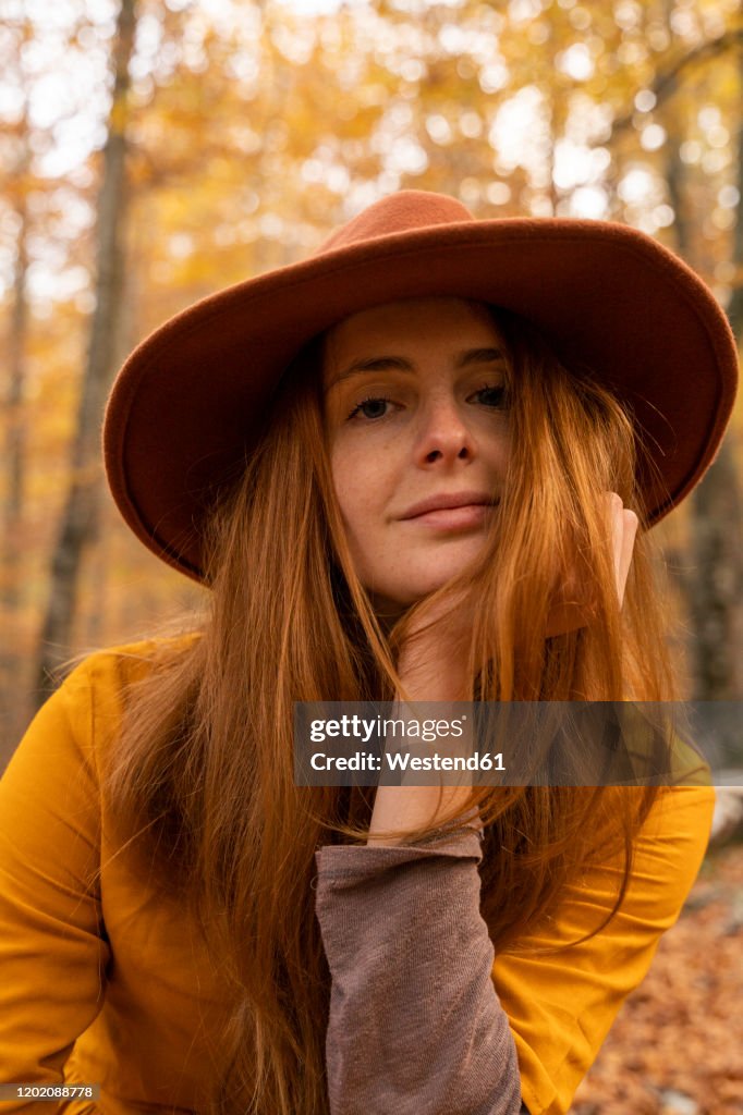 Portrait Of Fashionable Redheaded Young Woman In Autumnal Forest High