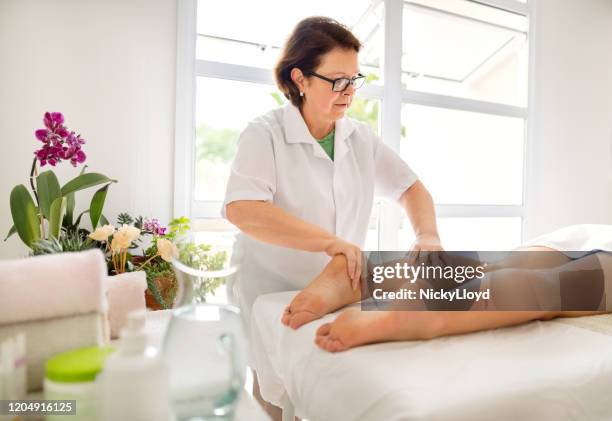 Calf Massage Photos And Premium High Res Pictures Getty Images