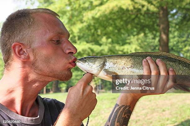 Man Kissing Fish Photos and Premium High Res Pictures - Getty Images Man Kissing Fish Photos and Premium High Res Pictures - Getty Images