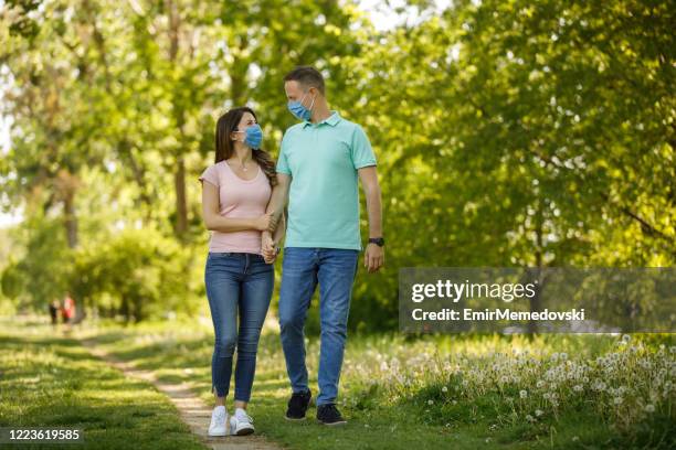 Masked Couple Walking Photos And Premium High Res Pictures Getty Images