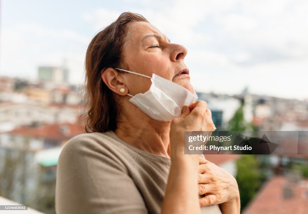Woman Takes Off Medical Mask Female Breathes Deeply High Res Stock