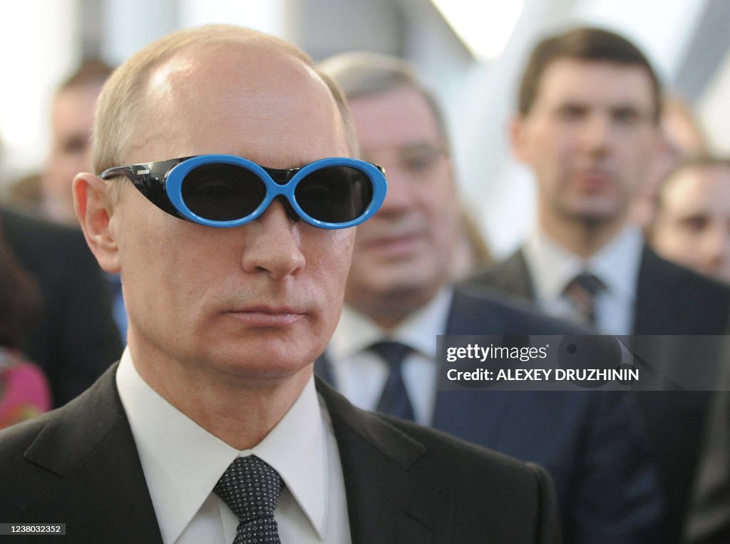 Russian Prime Minister Vladimir Putin Wears Glasses As He Visits The