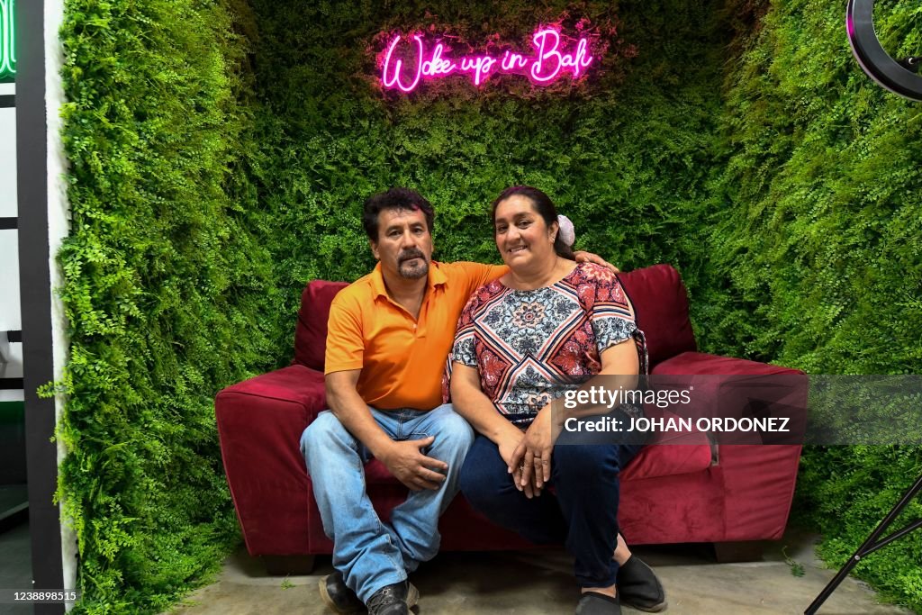 A Couple Poses On A Photograph Spot At The Selfie Museum In Antigua