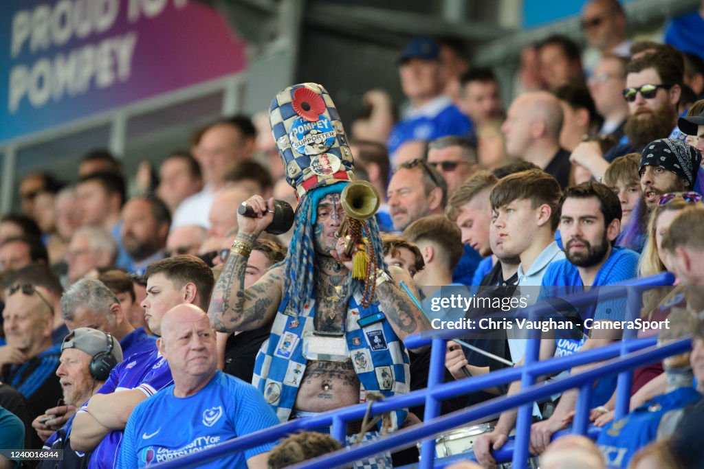 Portsmouth fan, John Portsmouth Football Club Westwood, watches his ... Portsmouth fan, John Portsmouth Football Club Westwood, watches his ...