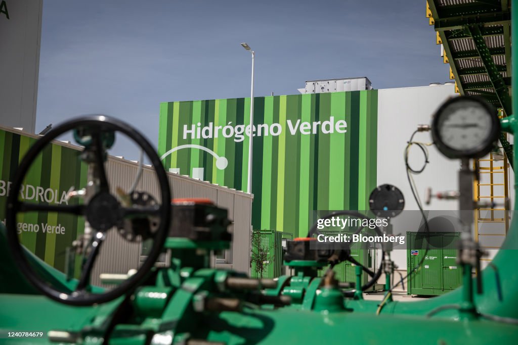 A Green Hydrogen Sign On The Exterior Of The Electrolyzer During The