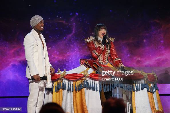 Host Nick Cannon And Hayley Orrantia In The Masked Singer Season