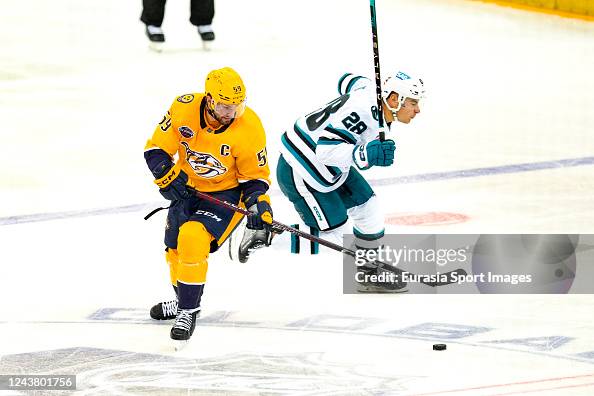 Roman Josi Of The Nashville Predators Plays The Puck Past Timo Meier