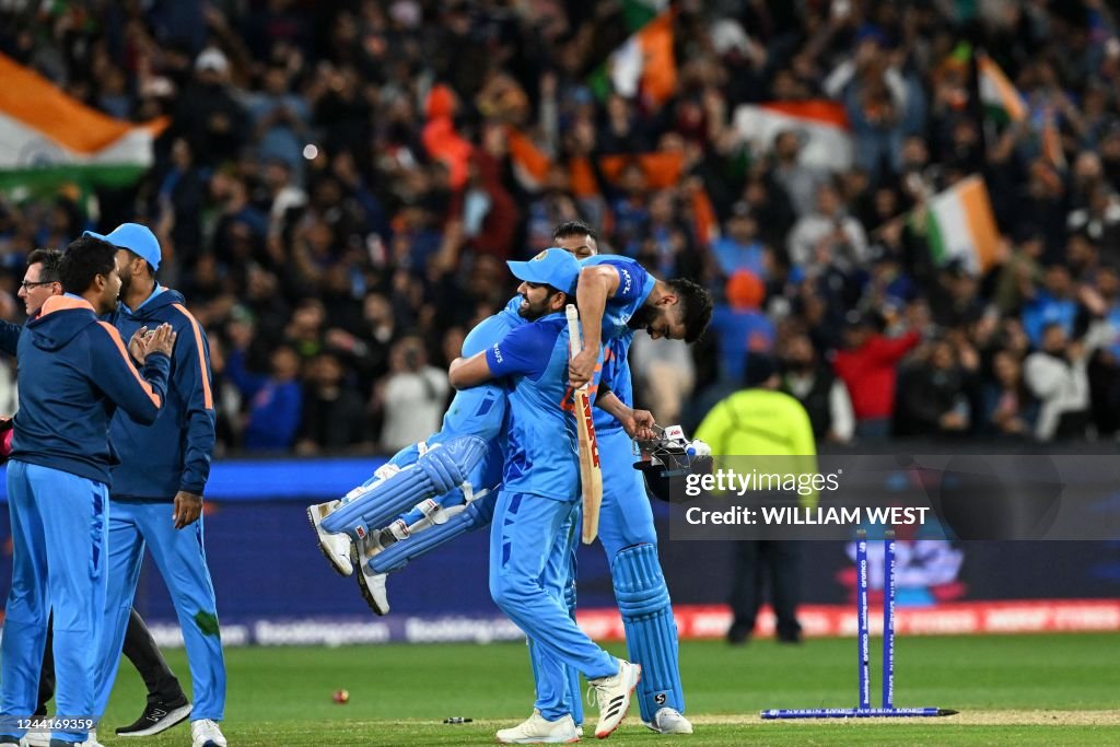India's Captain Rohit Sharma lifts Virat Kohli as they celebrate ... India's Captain Rohit Sharma lifts Virat Kohli as they celebrate ...