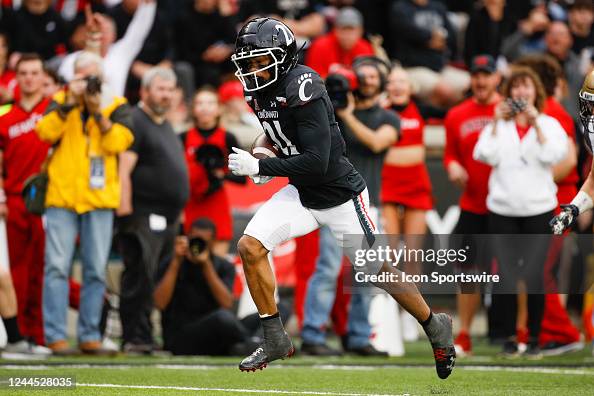 Cincinnati Bearcats wide receiver Tyler Scott carries the ball for a ... Cincinnati Bearcats wide receiver Tyler Scott carries the ball for a ...