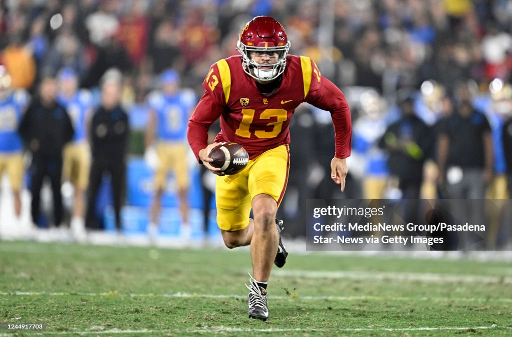quarterback Caleb Williams of the USC Trojans scrambles against the ... quarterback Caleb Williams of the USC Trojans scrambles against the ...